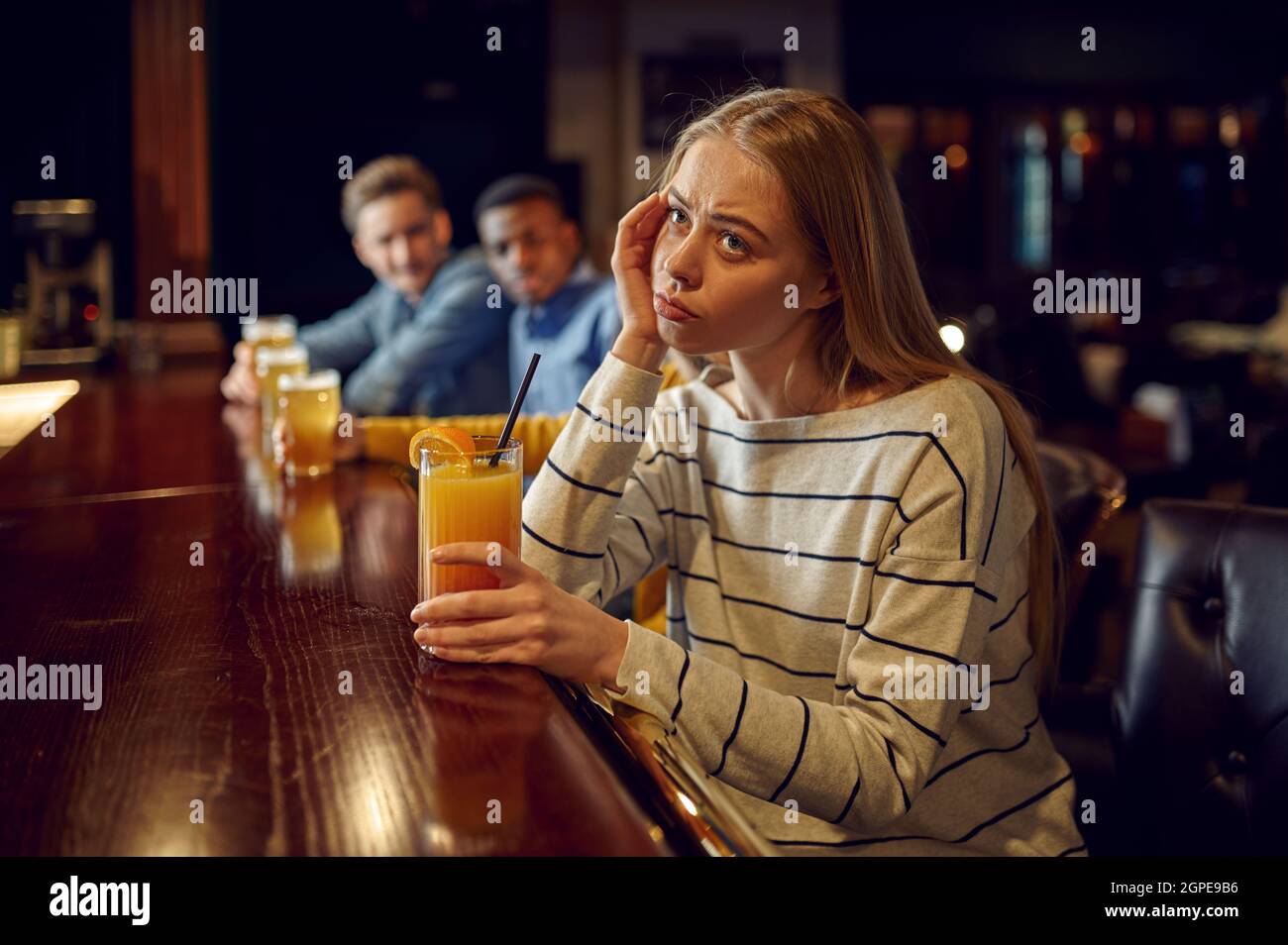 Bored Girl in a night club waiting for her partner Stock Photo - Alamy