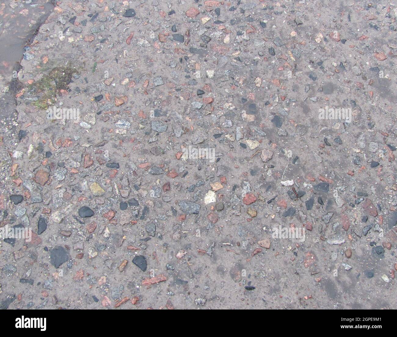 wet concrete texture background with small stones in it Stock Photo - Alamy