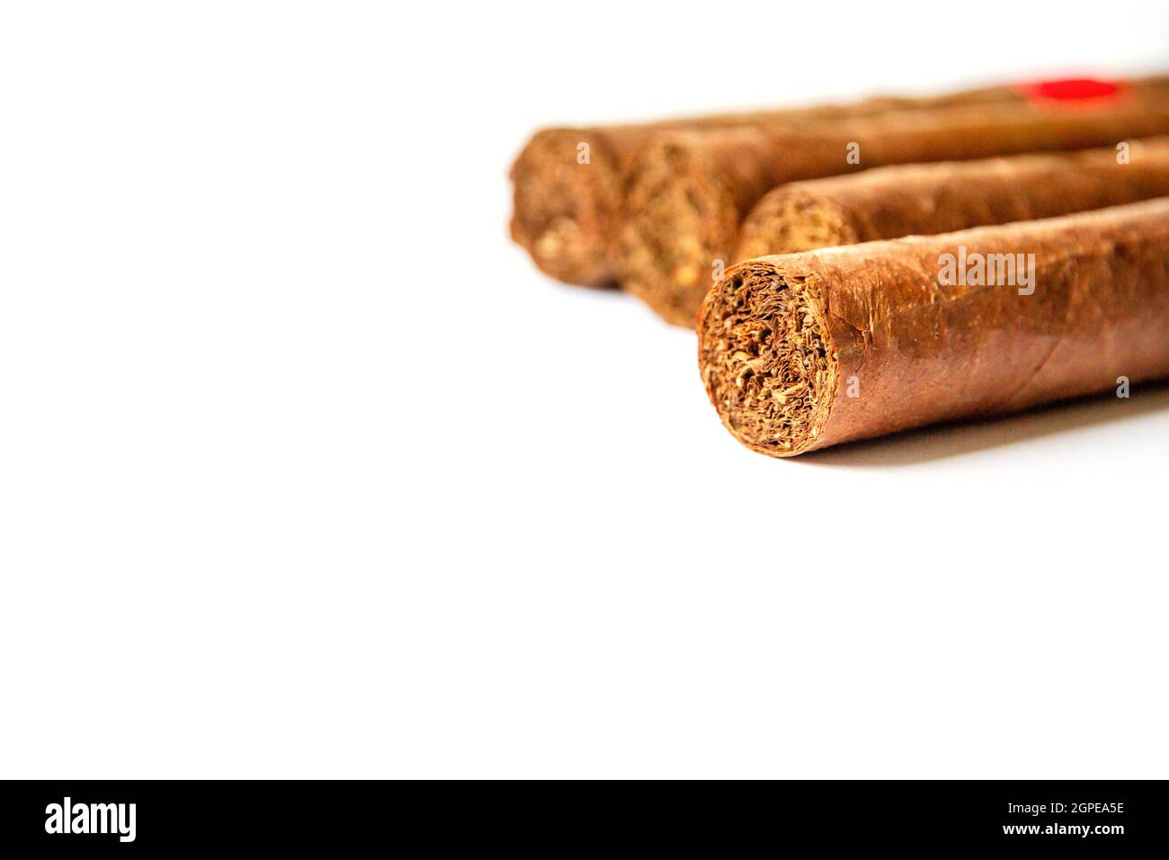 Group of brown cuban cigars isolated on white background Stock Photo ...