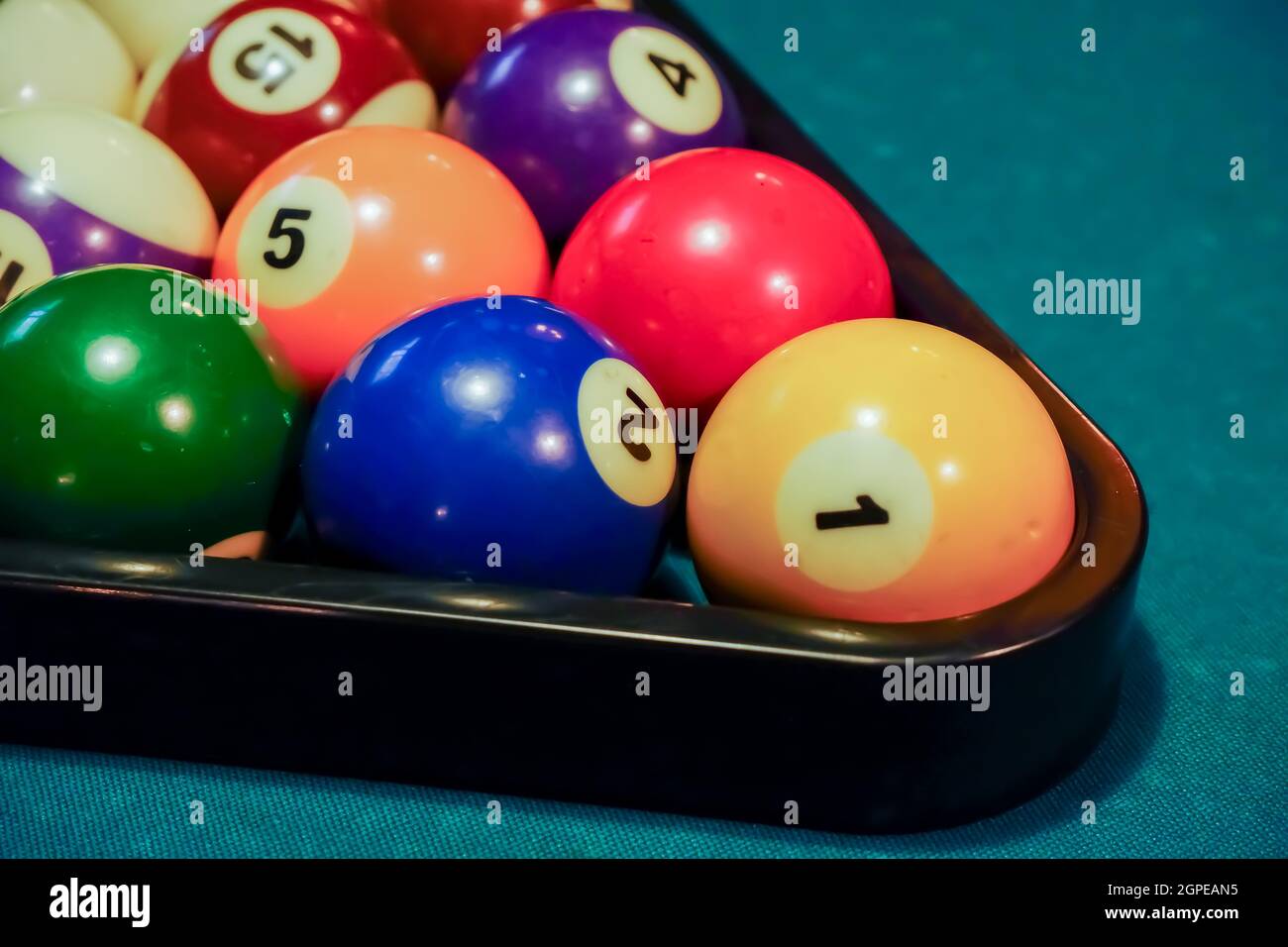 the pool player puts the balls to play in a position to hit Stock Photo ...