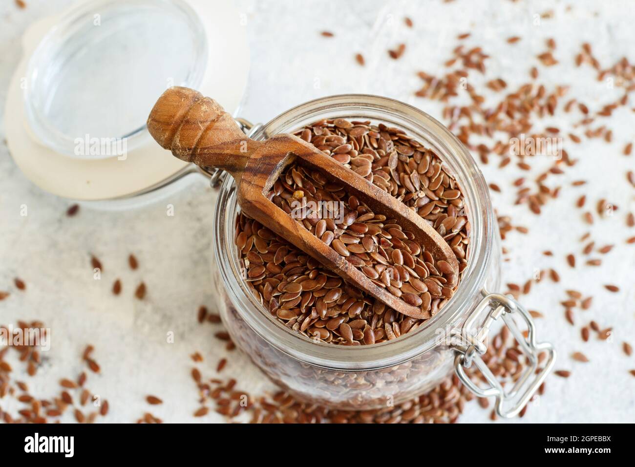Raw Flax seeds in a jar with a scoop close up Stock Photo - Alamy