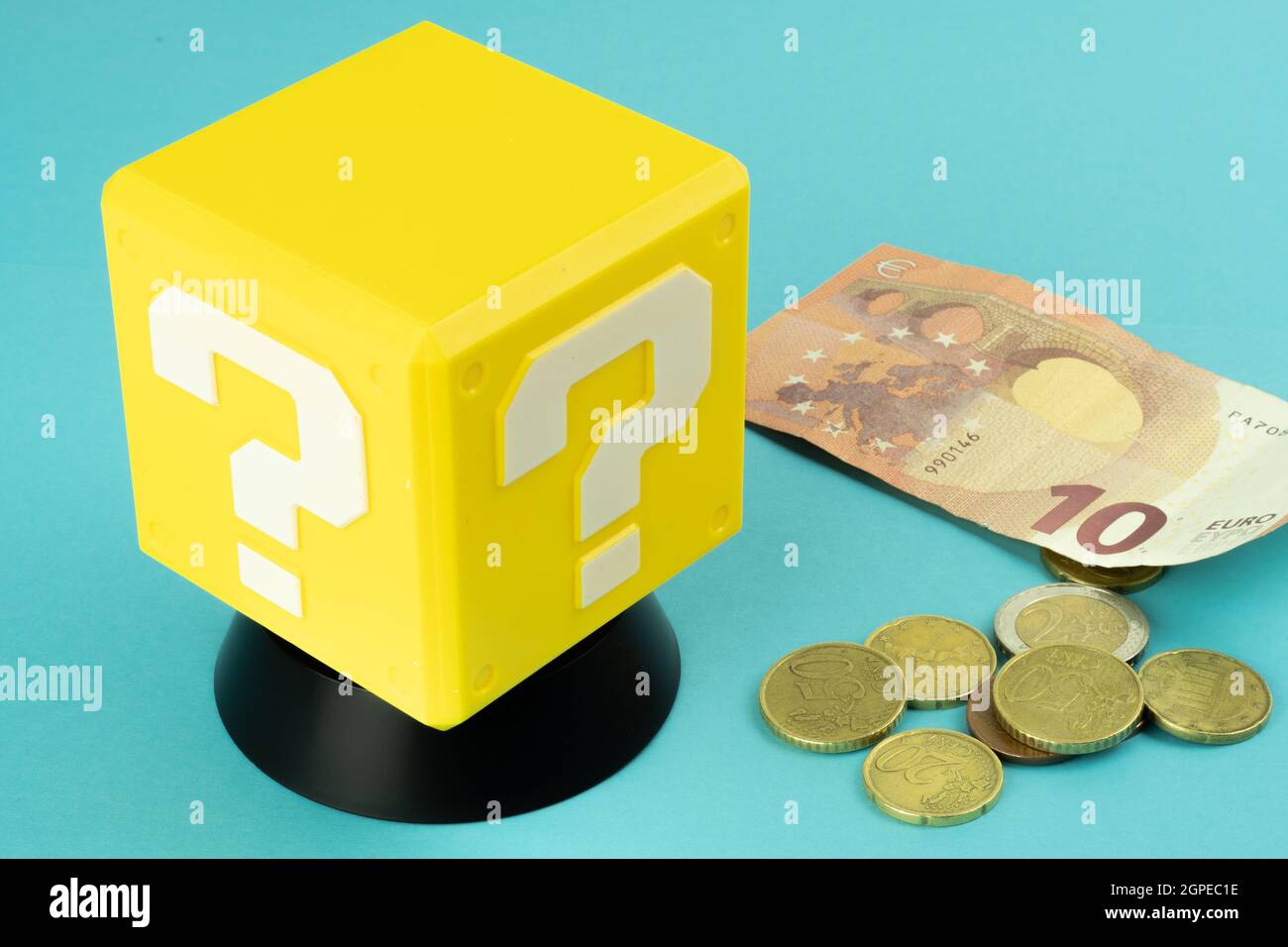 Question mark on blue background and coins and banknote Stock Photo - Alamy