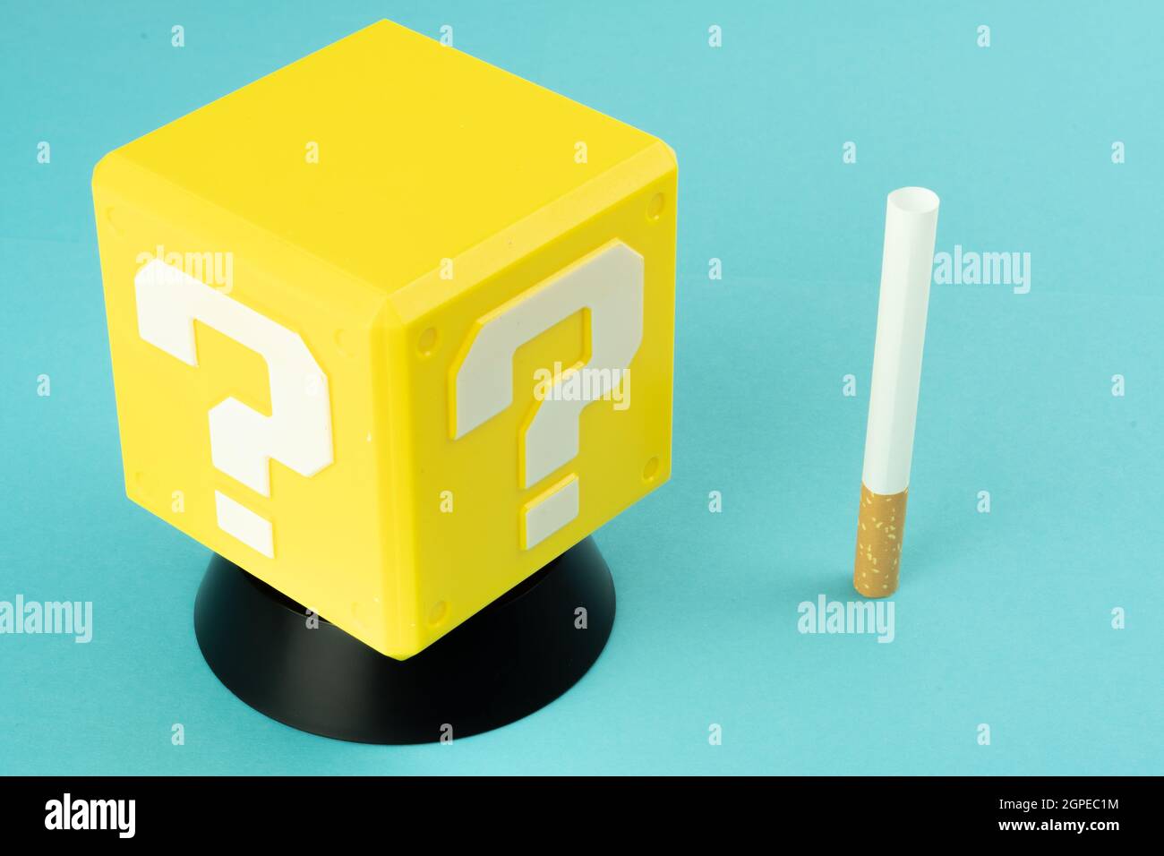 Question mark on blue background and cigarette and glass of whiskey ...