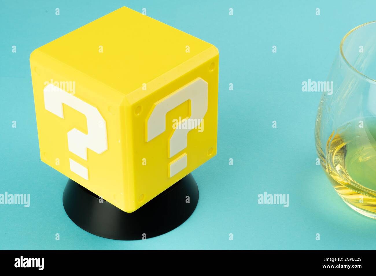 Question mark on blue background and cigarette and glass of whiskey ...