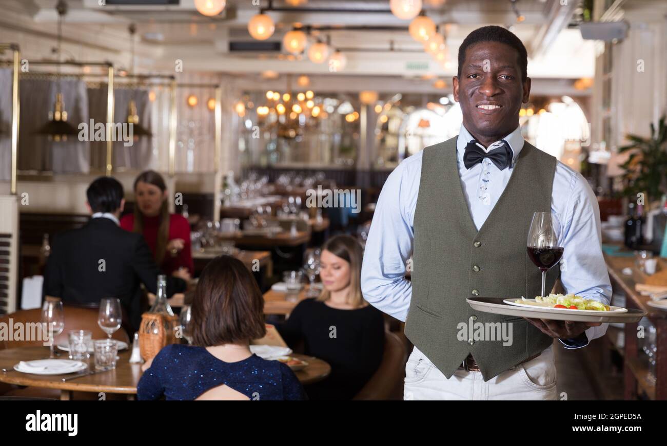 African American waiter with serving tray Stock Photo - Alamy