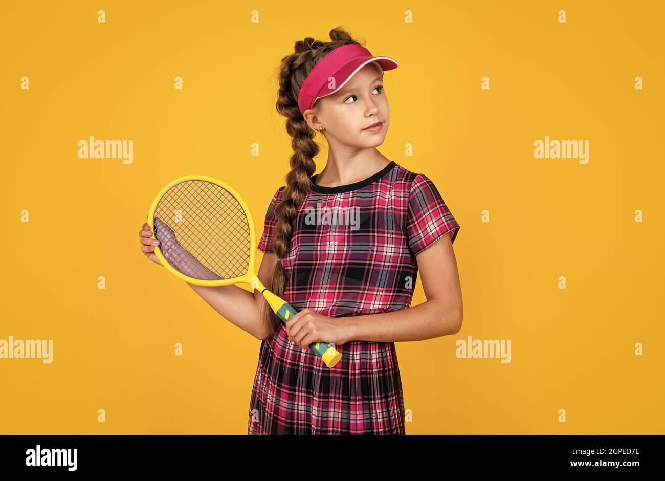 teen girl in fitness cap holding tennis or badminton racket, sport ...