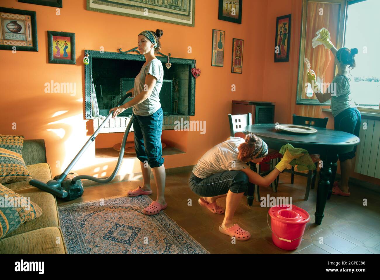 House cleaning concept, one woman transforms into several women to ...