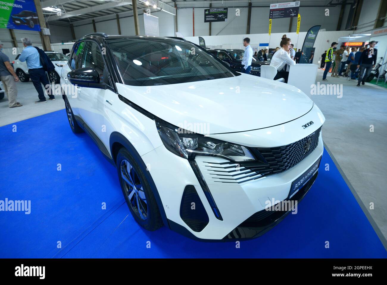 Crossover plug-in hybrid Peugeot 3008 parked on stand. Plug-in Ukraine ...