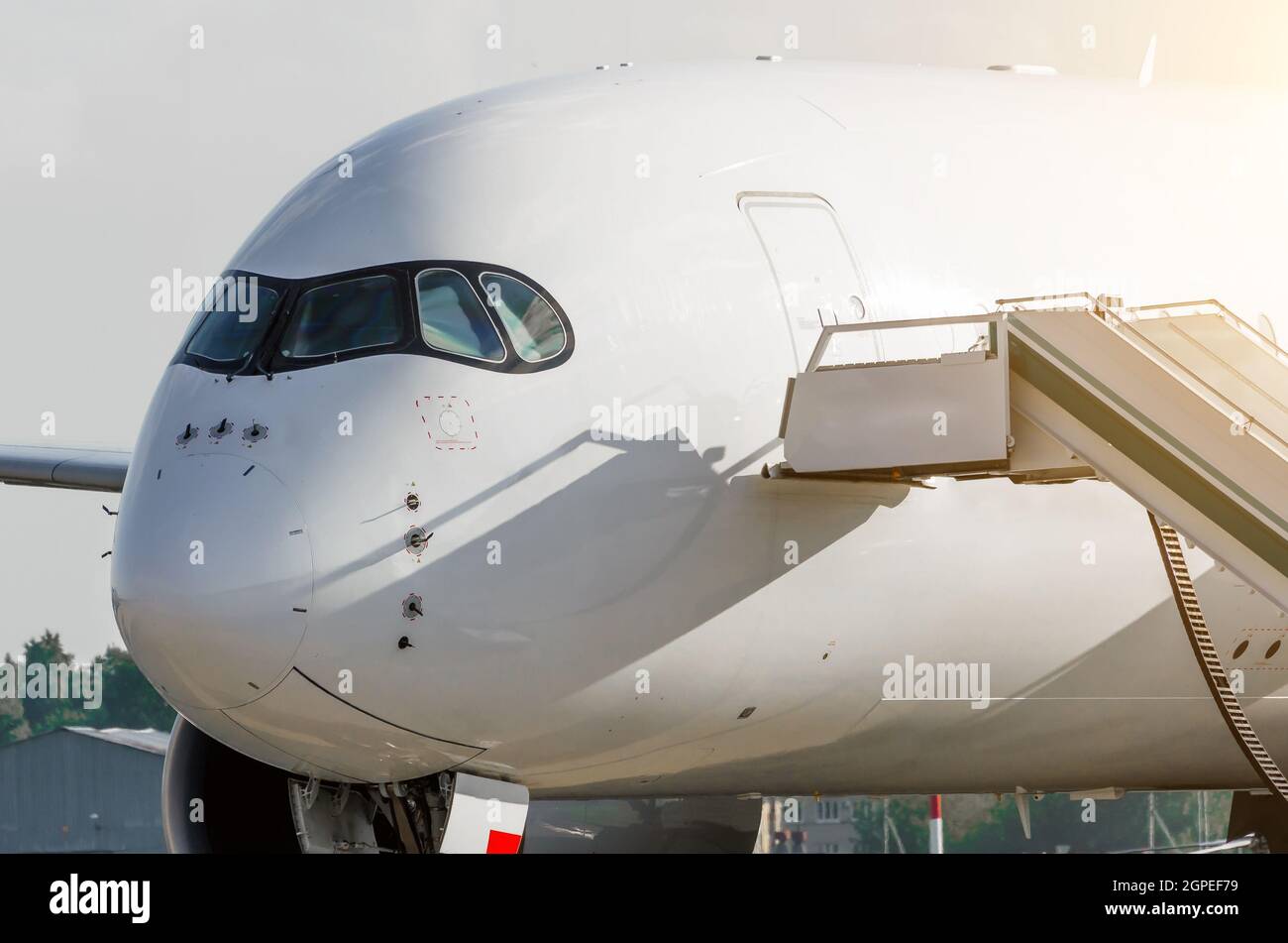 Nose of the passenger and the cockpit of the pilot, airplane close up ...