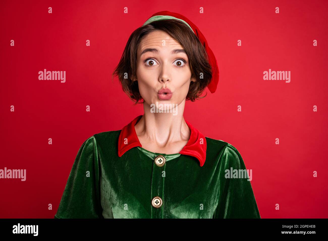 Photo of young woman amazed shocked surprised omg wow fake novelty news isolated over red color ...