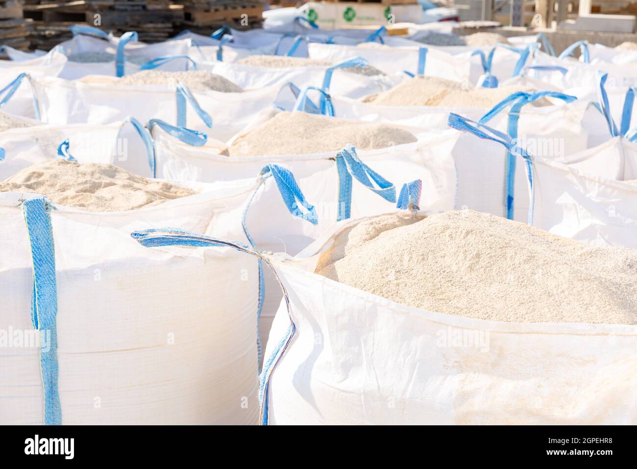 Bags with bulk construction materials outdoors Stock Photo - Alamy