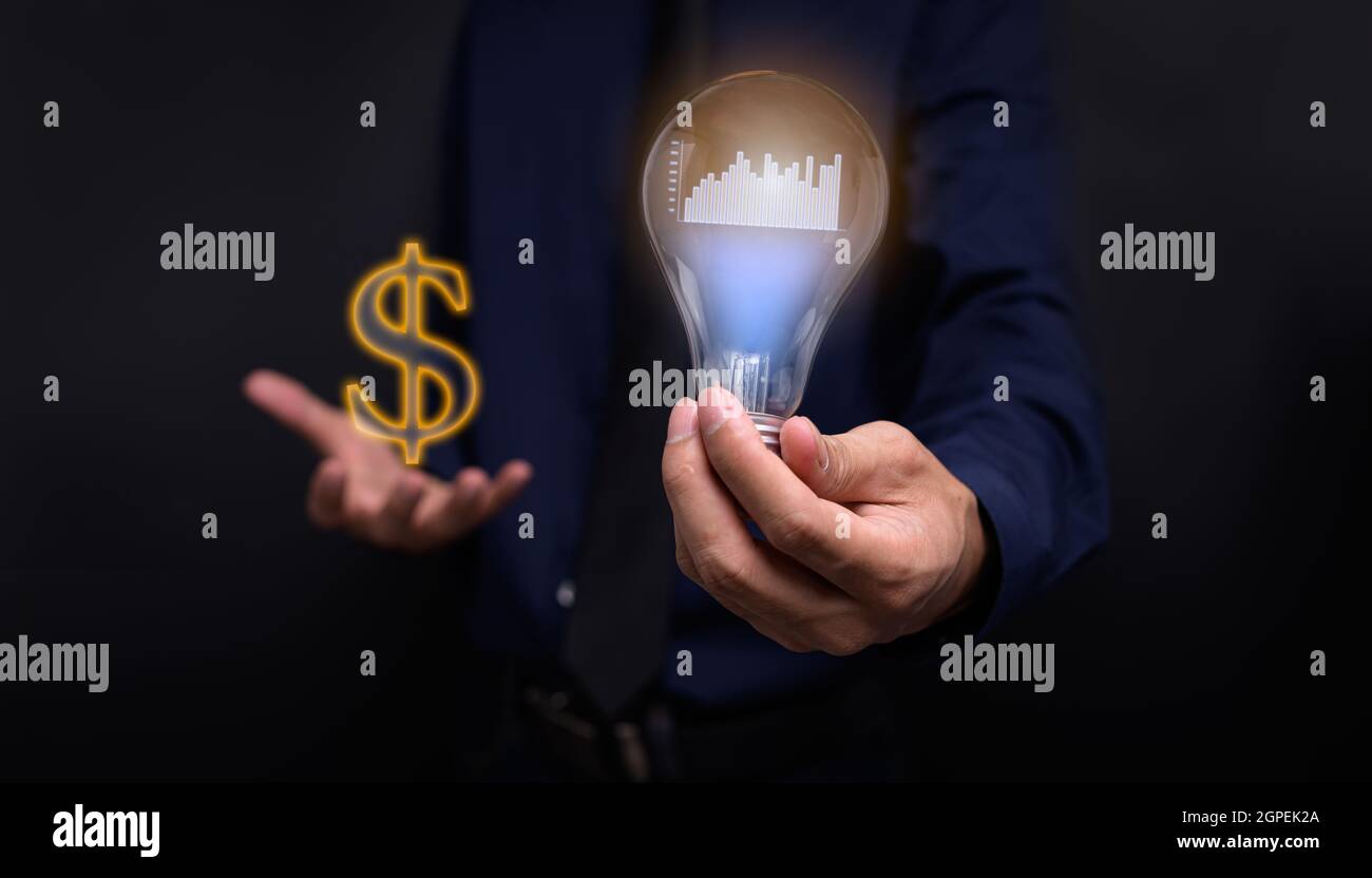Handheld concept light bulb bar graph idea stock investment Stock Photo ...