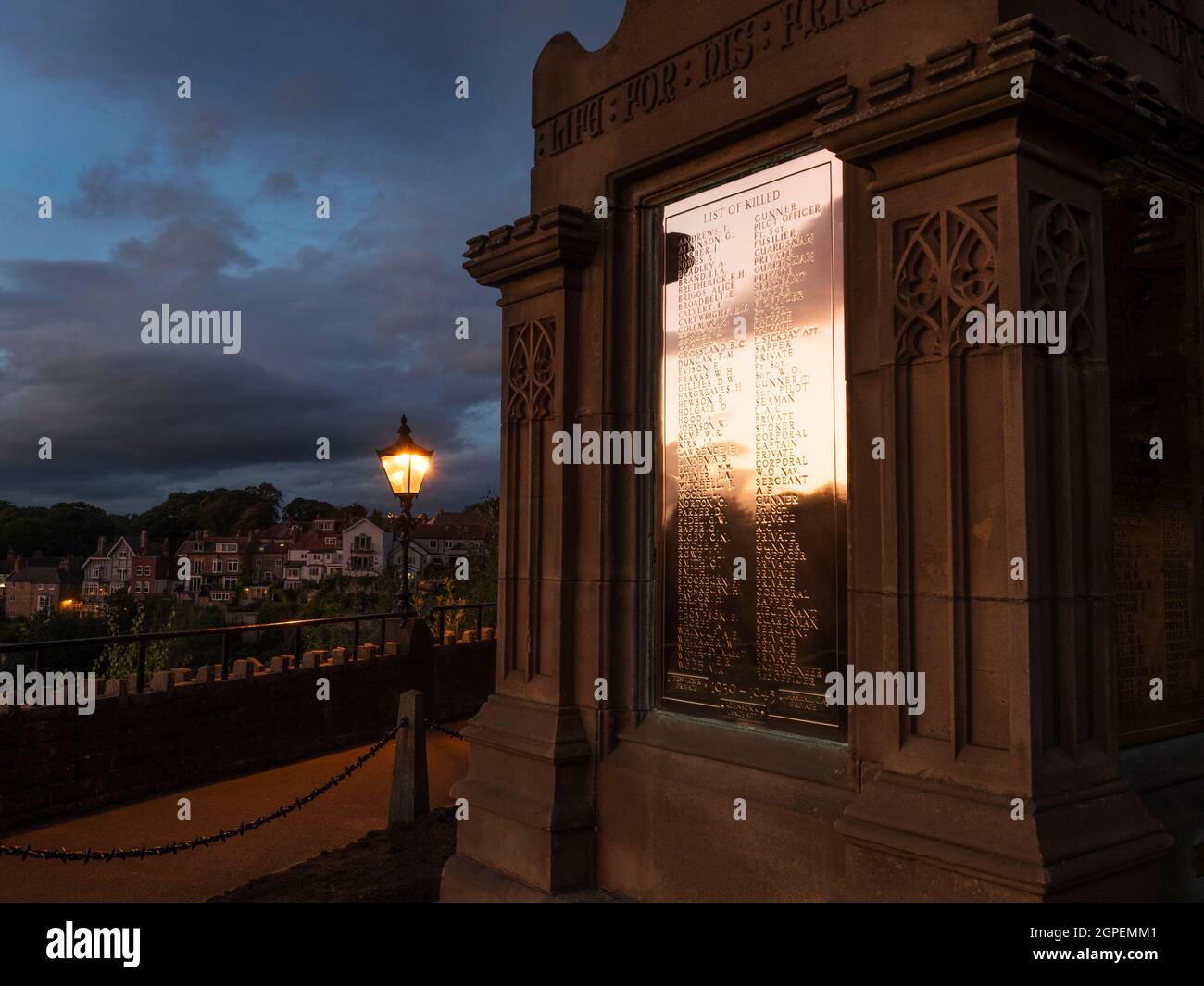 War memorial plinth with Second World War list of killed at dusk ...