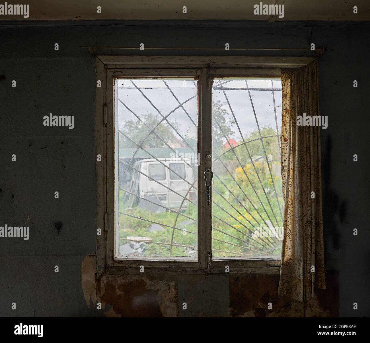 Old dirty window with tattered curtains in old abandoned building ...