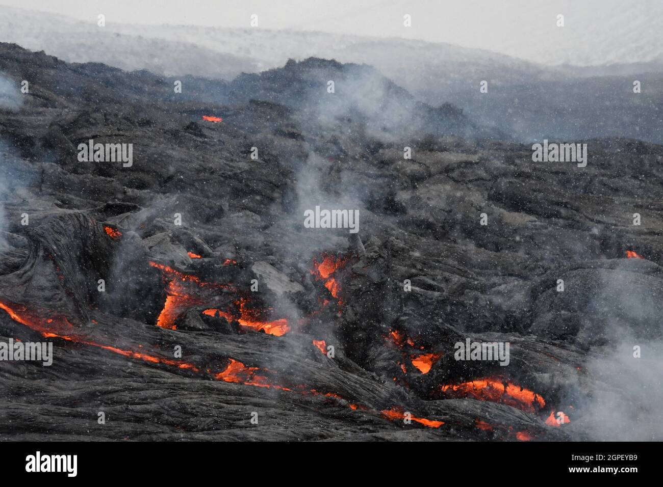 Lava flow at Fagradalsfjall, Iceland. Molten red and orange lava flows ...