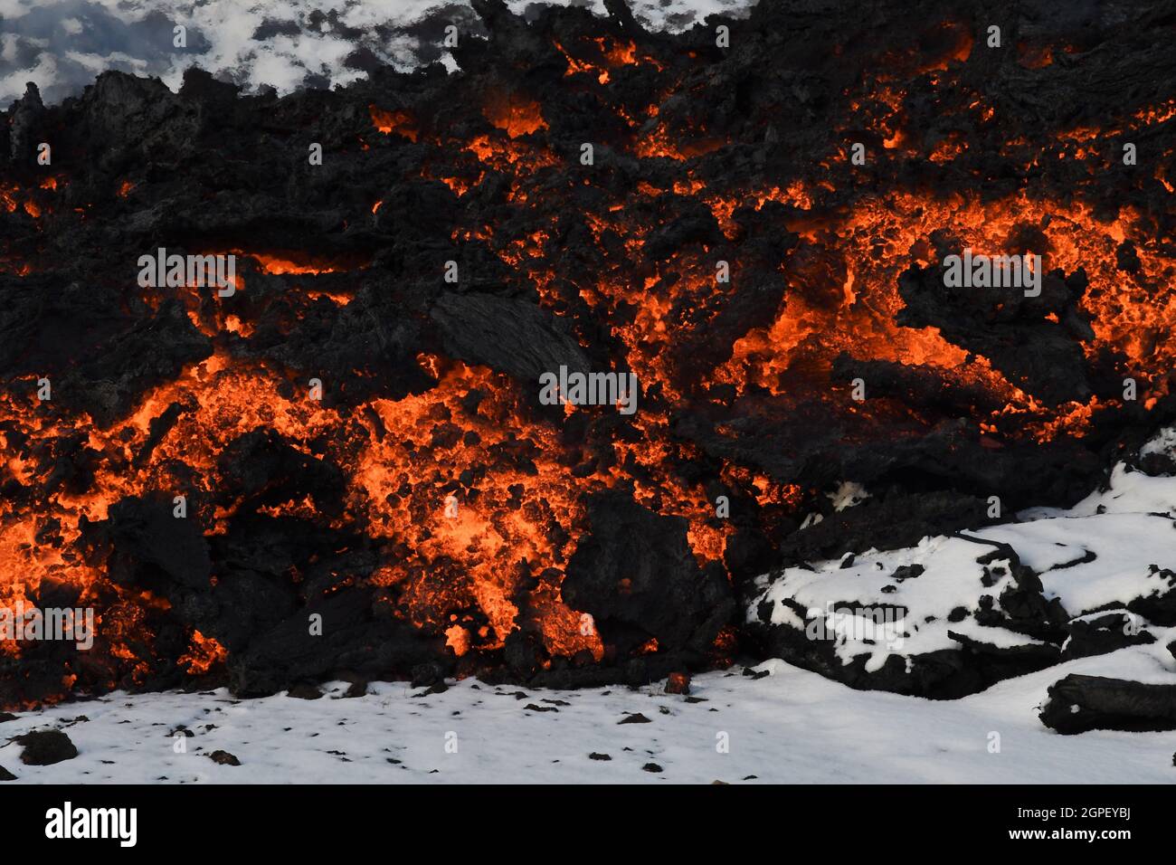 Lava flow at Fagradalsfjall, Iceland. Molten red and orange lava flows ...