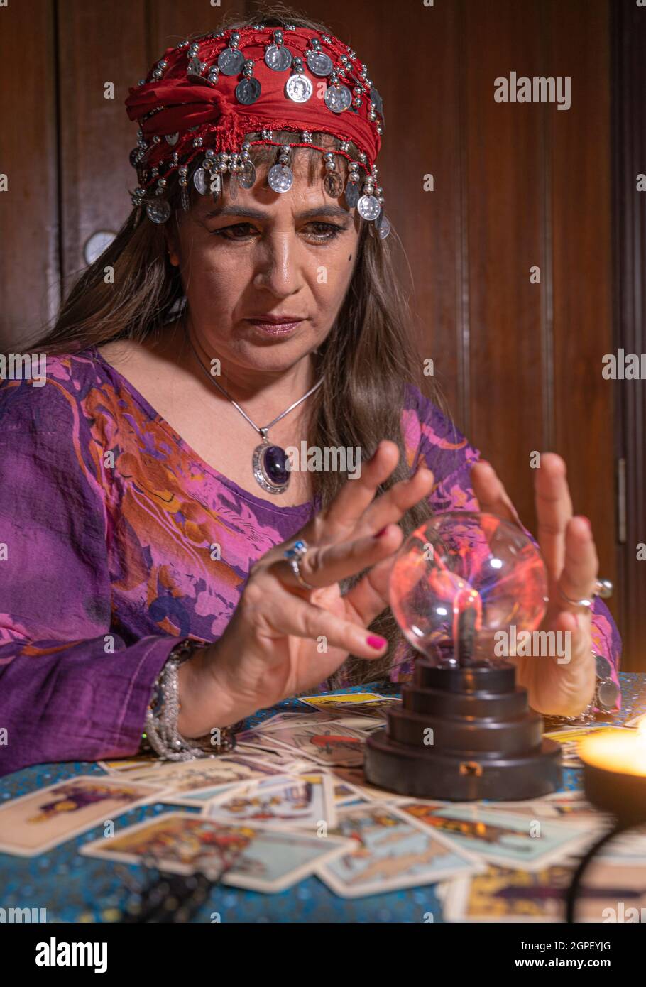 Psychic readings and clairvoyance concept - Fortune teller with hands ...