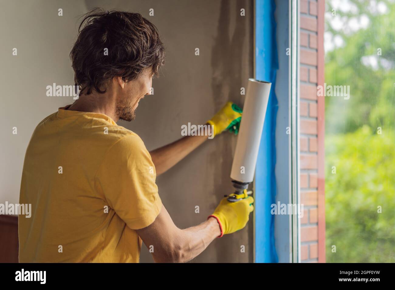 Builder or handyman is engaged in the repair or installation of windows ...