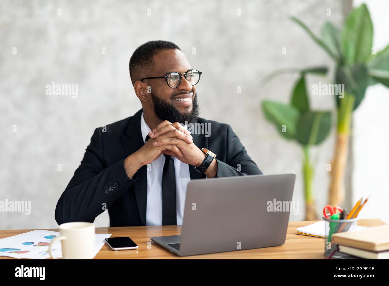 African man laptop thinking work hi-res stock photography and images ...
