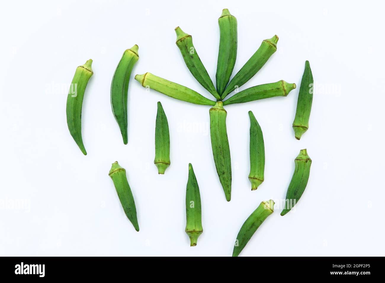 Raw okra or ladyfingers isolated on white background Stock Photo - Alamy