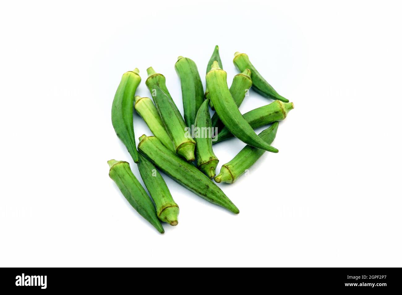 Raw okra or ladyfingers isolated on white background Stock Photo - Alamy