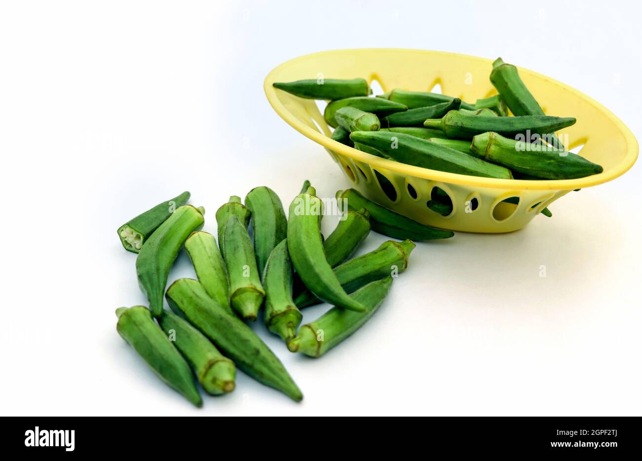 Raw okra or ladyfingers isolated on white background Stock Photo - Alamy