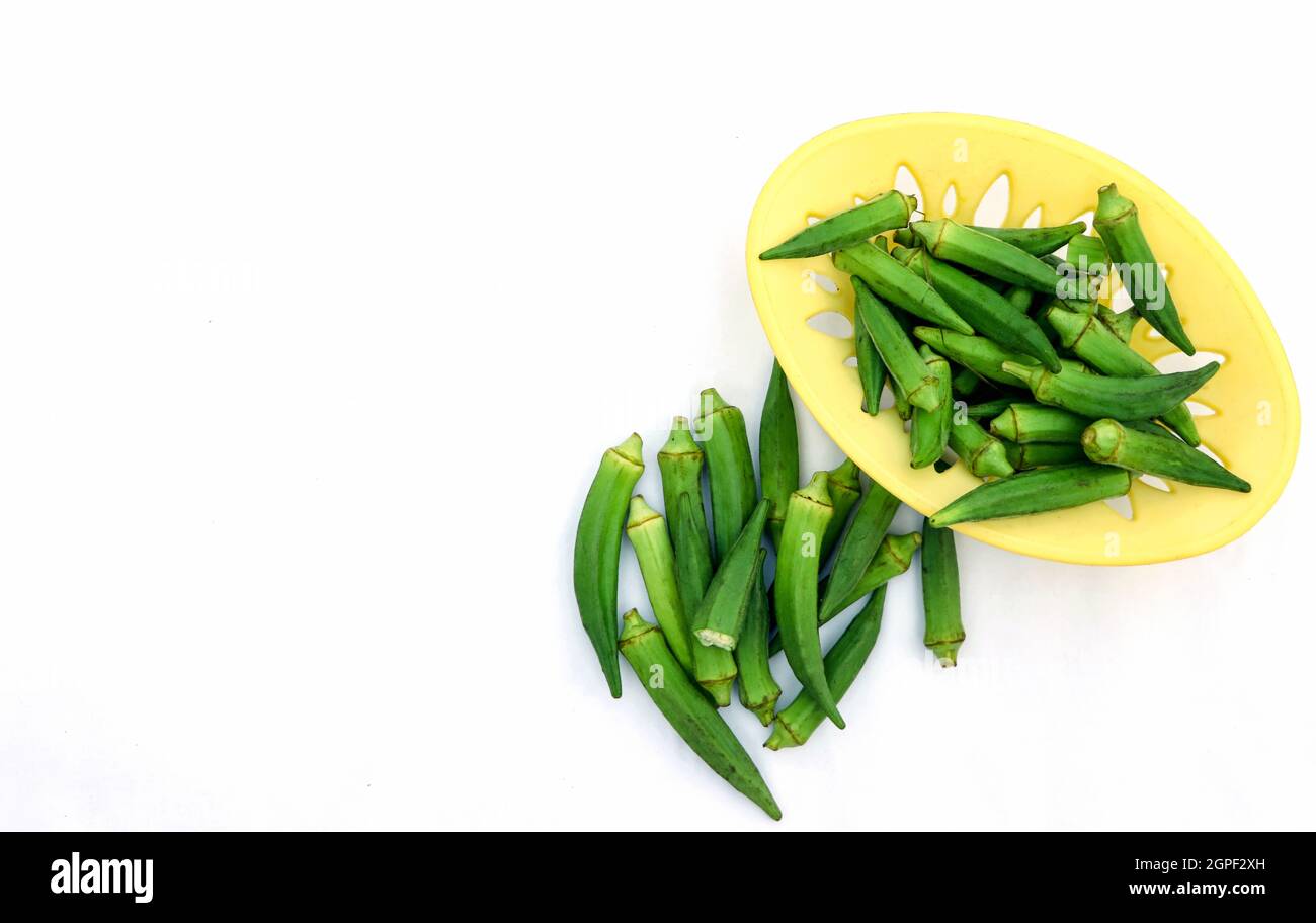 Raw okra or ladyfingers isolated on white background Stock Photo - Alamy