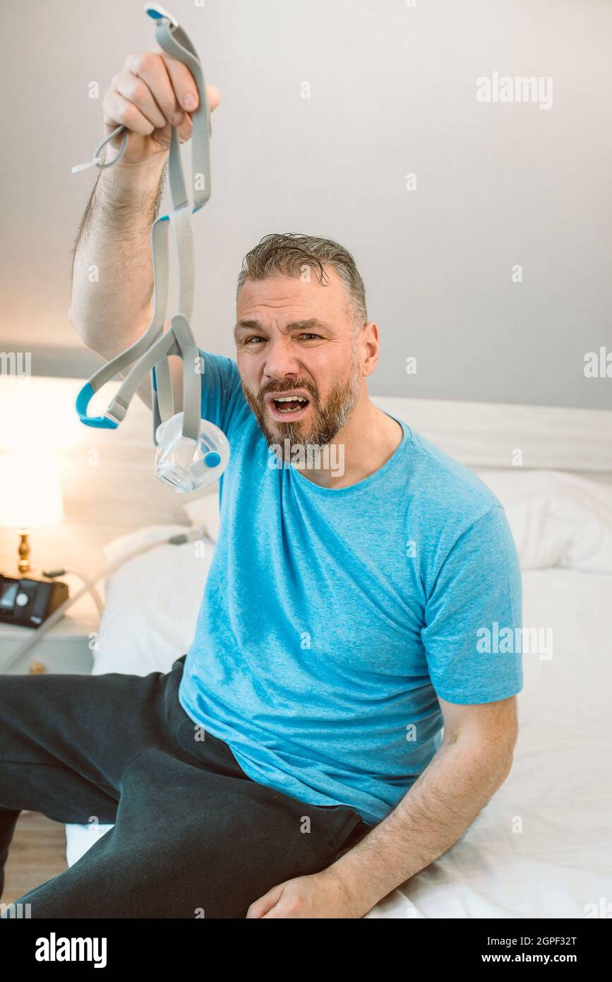 Unhappy shocked man with chronic breathing issues surprised by using ...