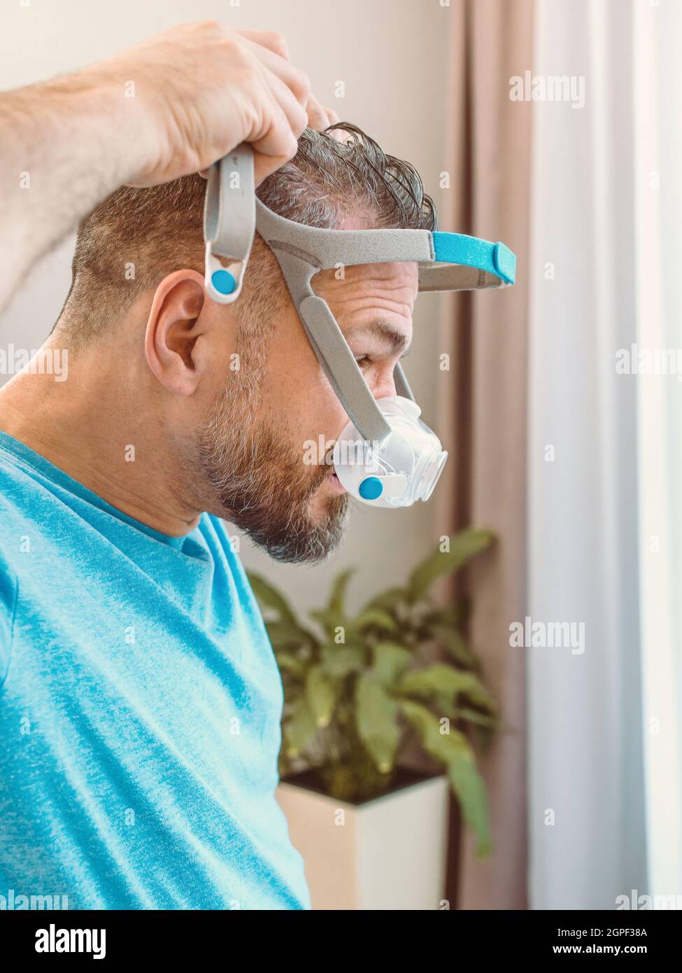 Happy rested man with chronic breathing issues after using CPAP machine ...