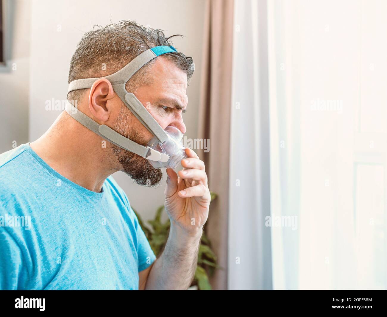 Mature happy man with chronic breathing issues considers using CPAP ...
