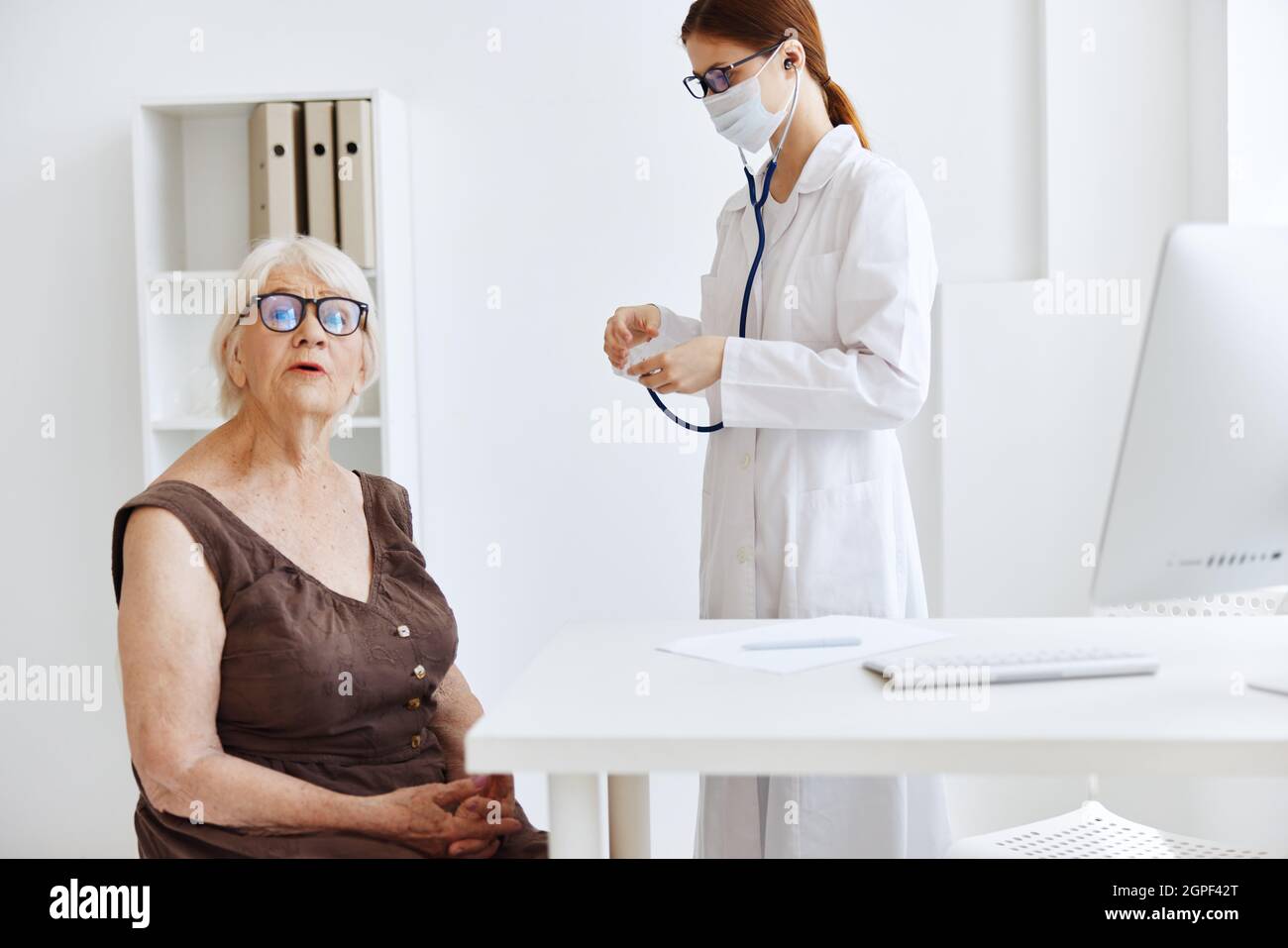 female doctor patient examination health care Stock Photo - Alamy