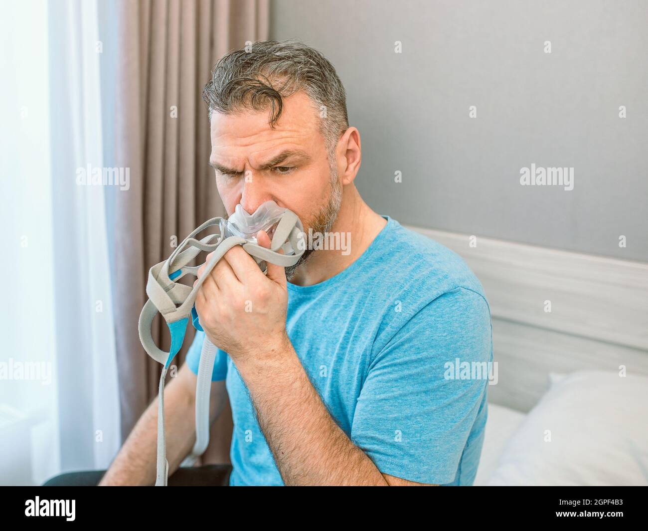 Unhappy shocked man with chronic breathing issues surprised by using ...