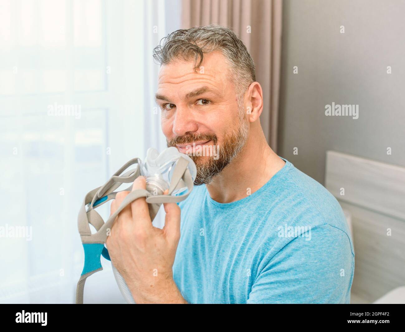 Mature happy man with chronic breathing issues considers using CPAP ...
