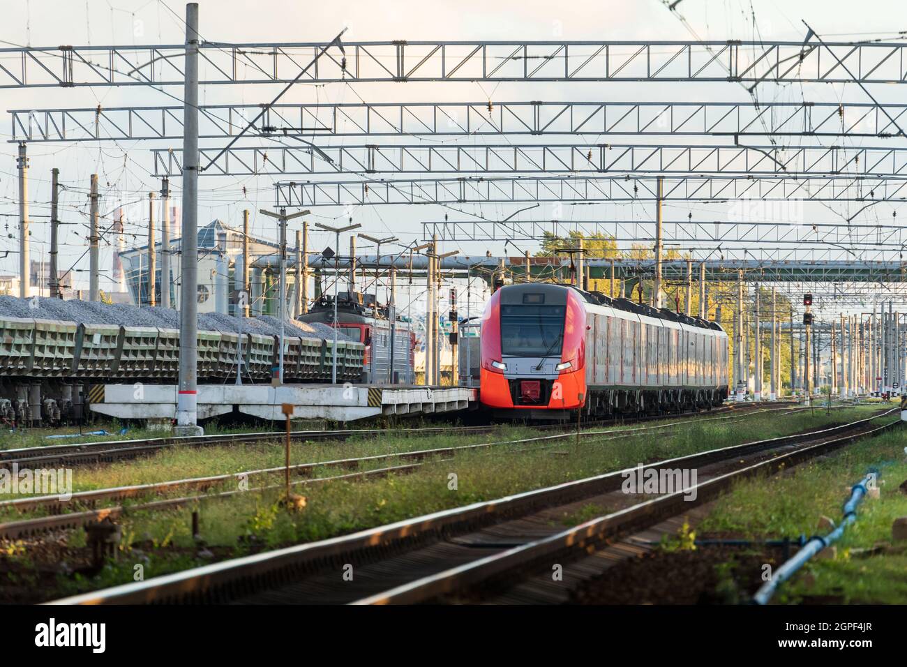 Modern intercity high speed train at sunset. Commercial suburban ...