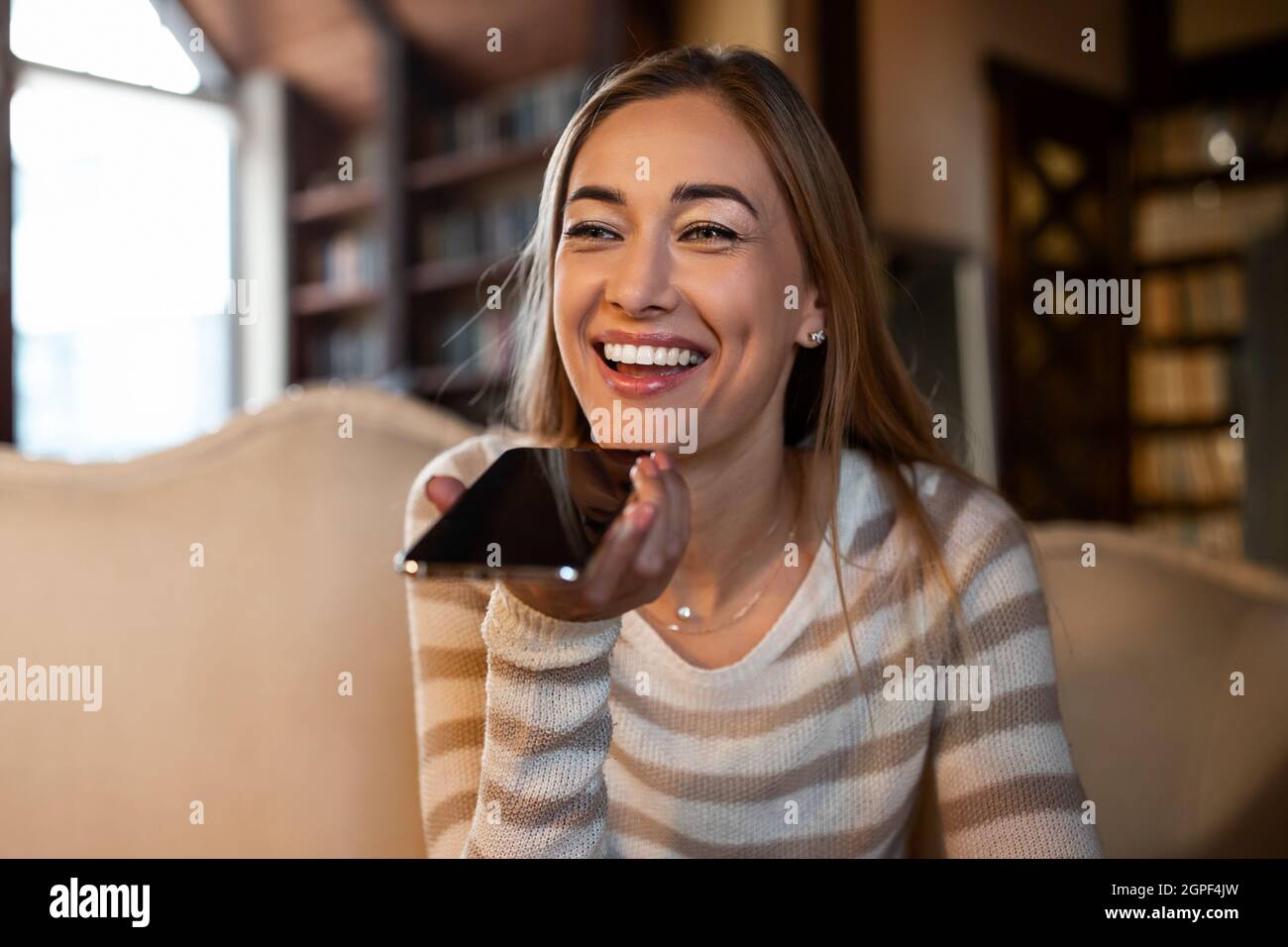 Person talking to voice assistant hi-res stock photography and images ...