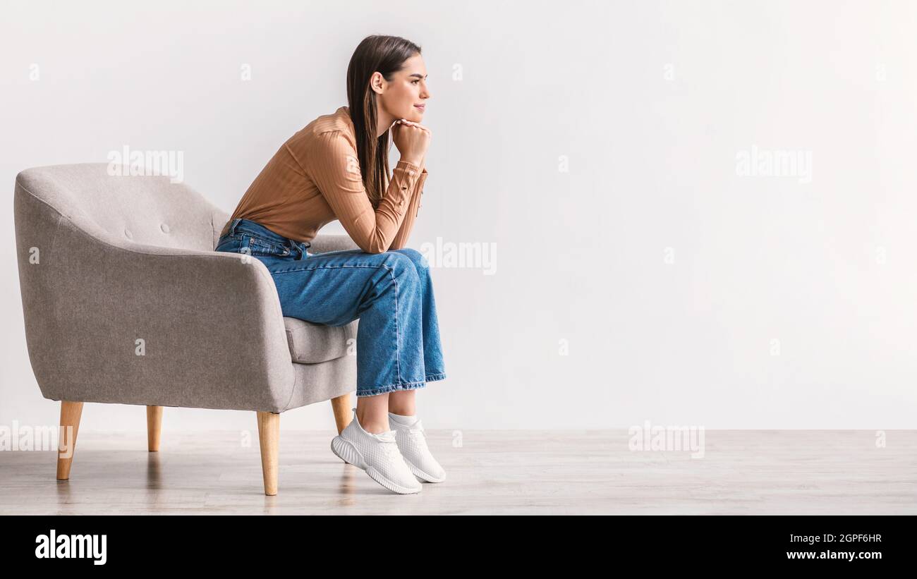 Thoughtful young woman looking at empty space with pensive dreamy ...