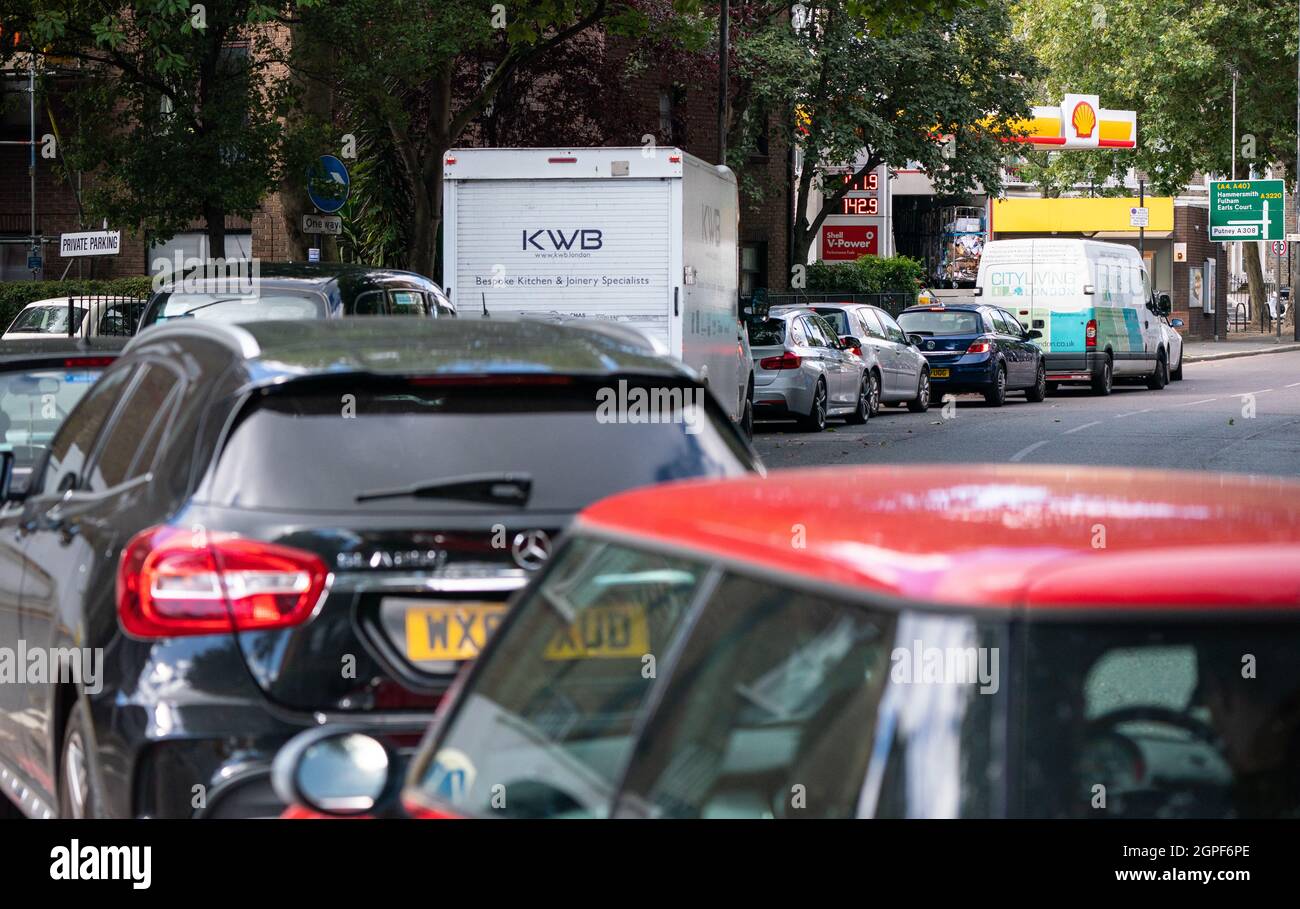 Vehicles queue for fuel at a petrol station in west London. Picture ...