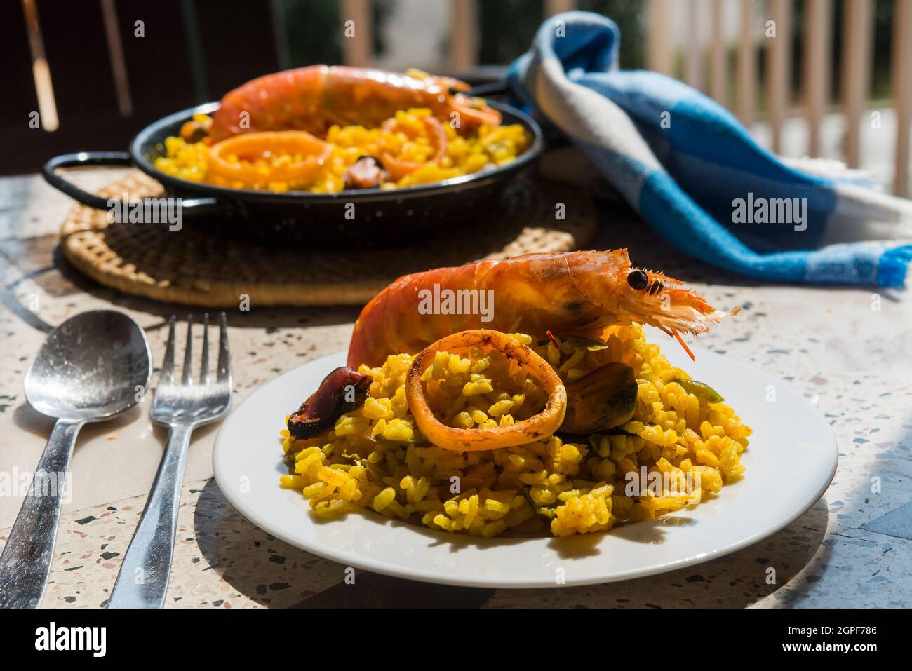 Paella typical spanish food in granite background Stock Photo - Alamy