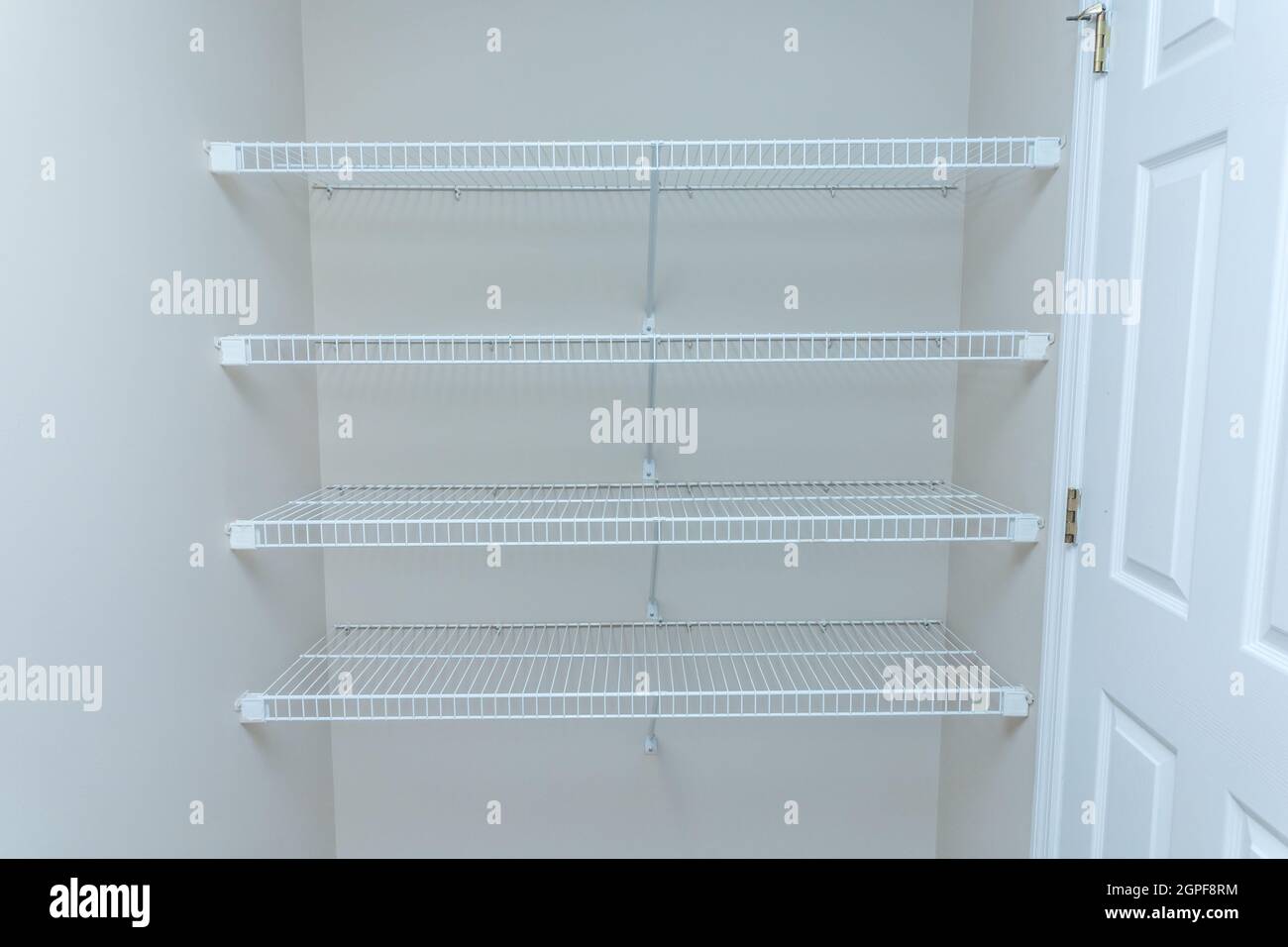 Empty wire shelving storage in an empty closet Stock Photo - Alamy