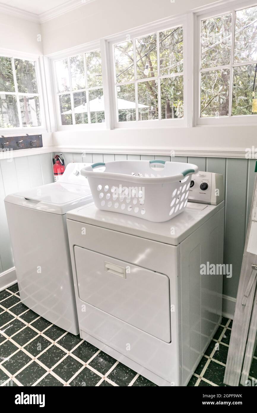 A vintage laundry room filled with windows and natural light Stock ...
