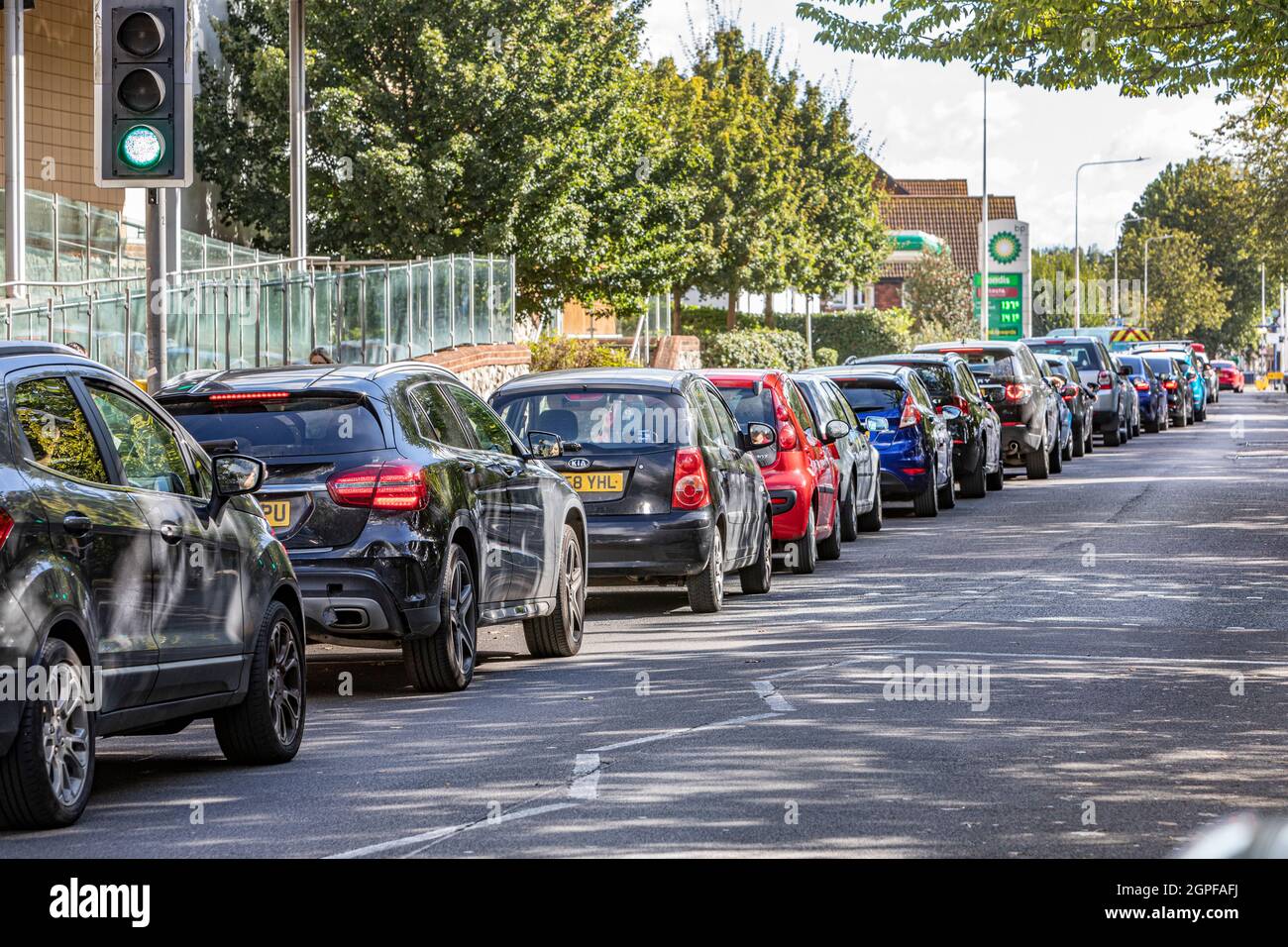 A line of cars waiting for fuel during the HGV drivers shortage fuel ...