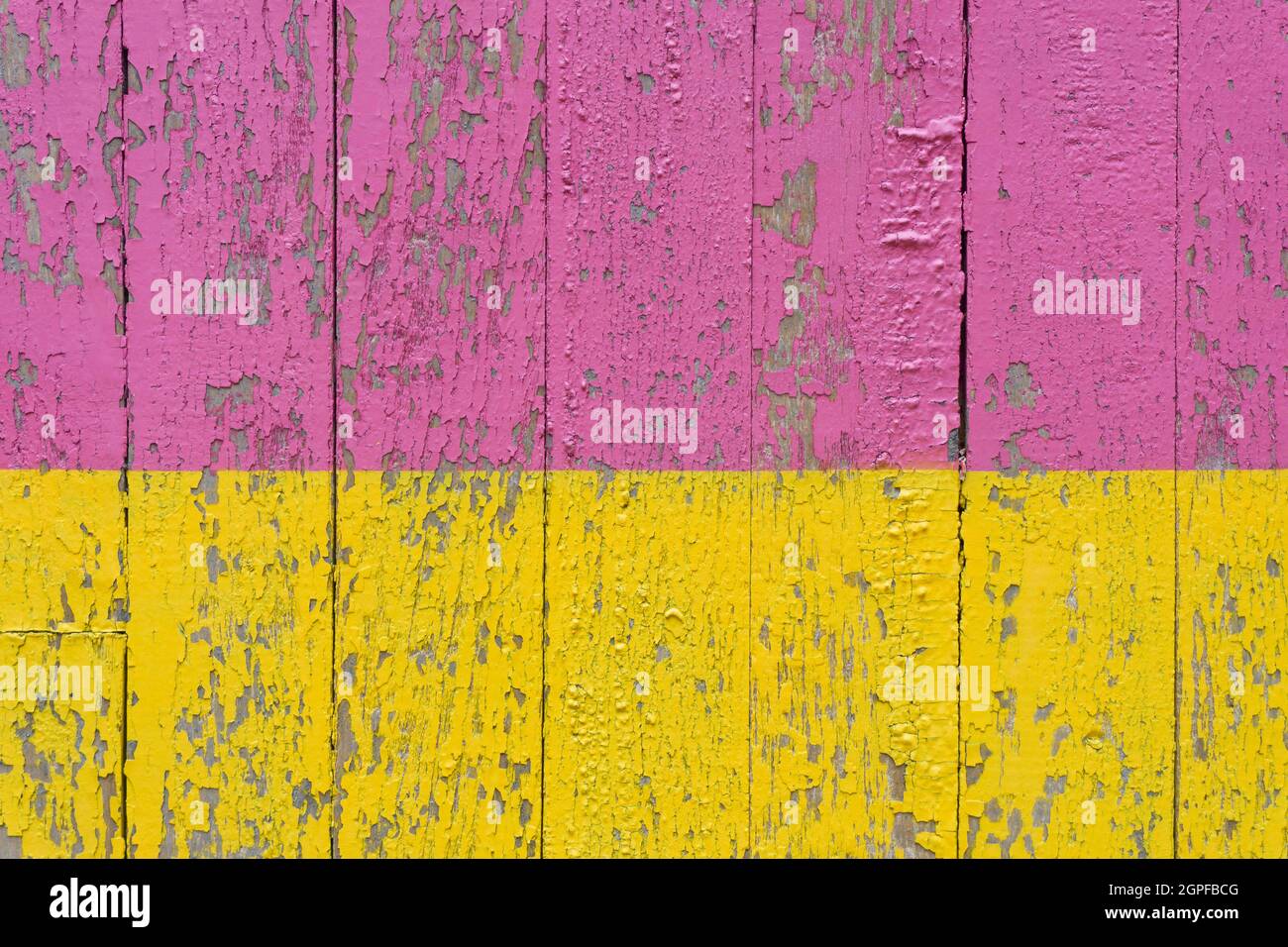 Colourful distressed wooden texture background painted pink and yellow ...