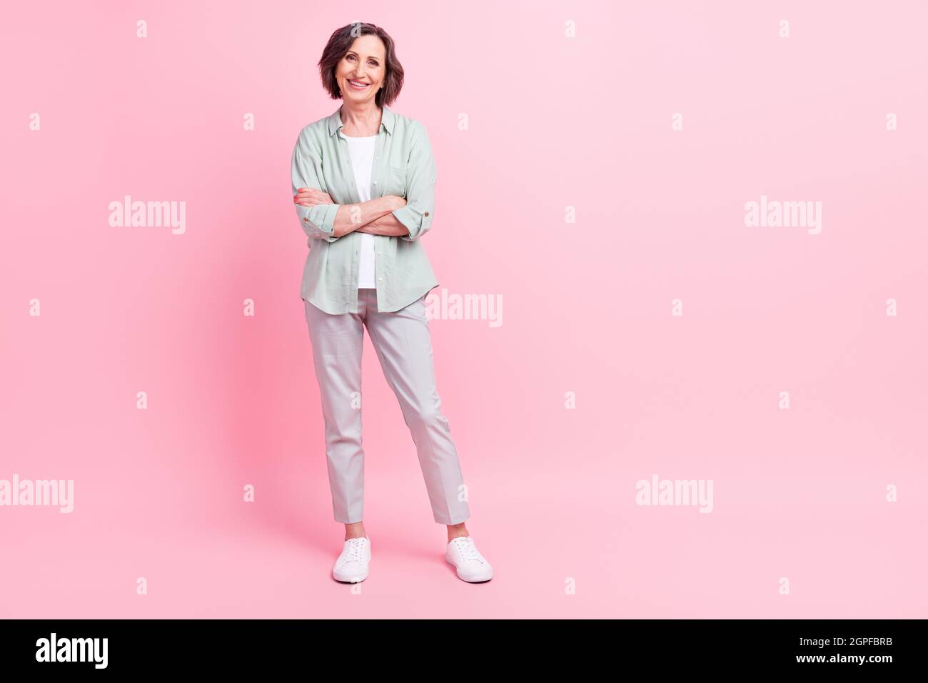 Full size portrait of positive candid aged person crossed arms have ...