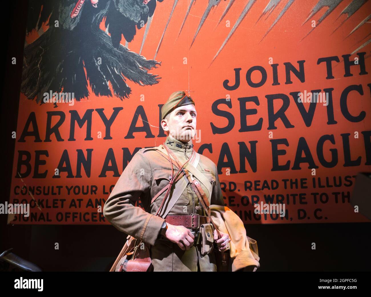 Soldiers in front of WWI recruiting, propaganda posters. At the ...