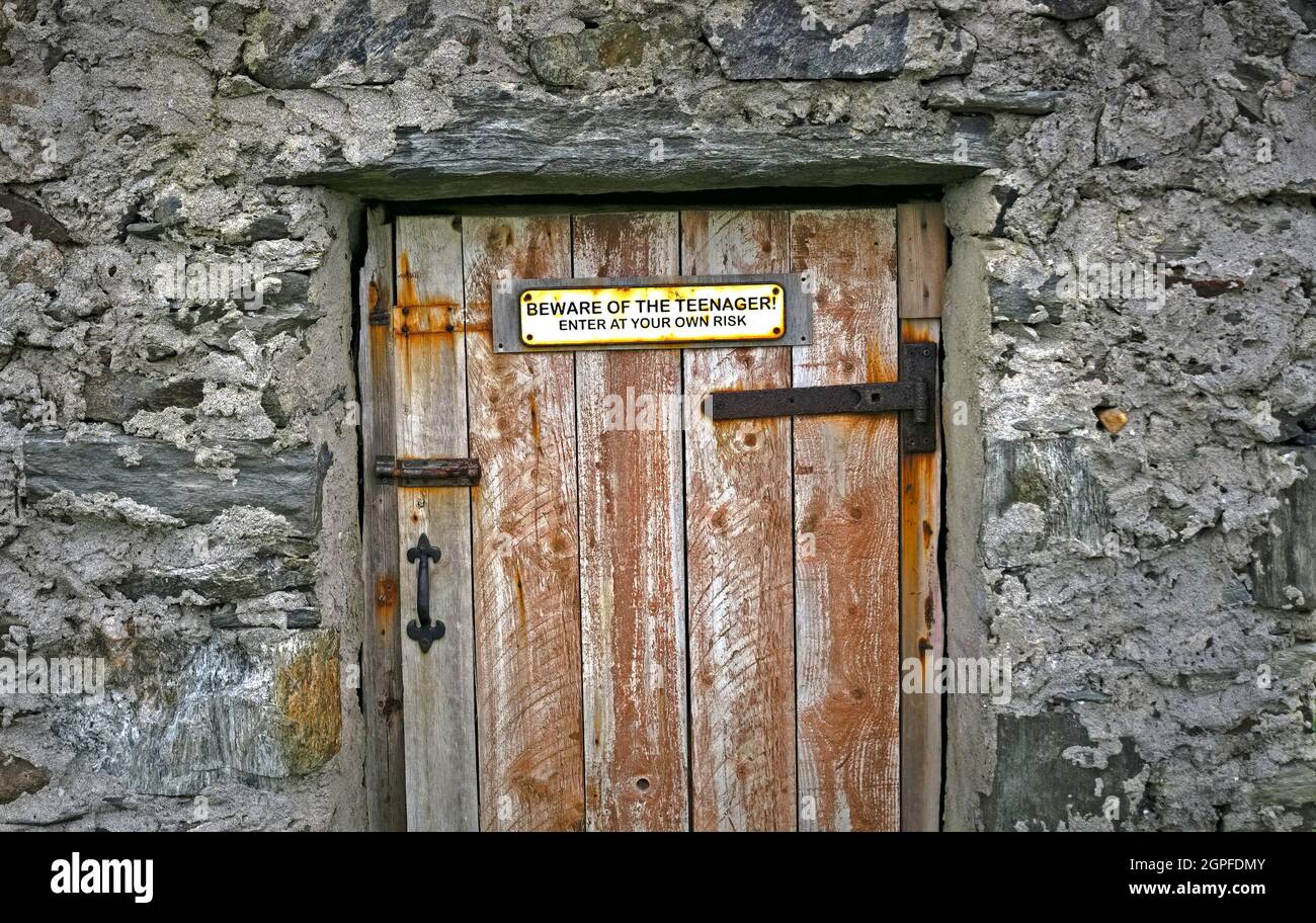 Beware of the teenager warning sign Stock Photo - Alamy