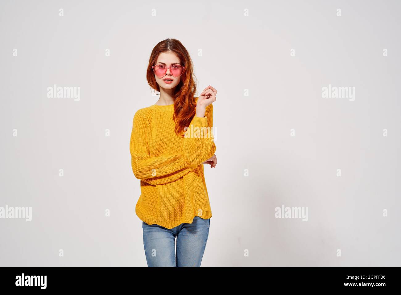 pretty woman in a yellow sweater hairstyle posing Studio fun model ...