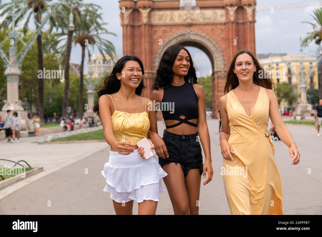 Group of delighted young multiracial ladies in stylish summer outfits ...