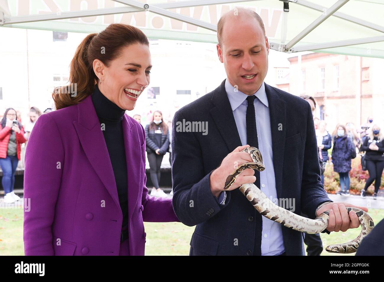 The Duke of Cambridge handles a snake during a tour of Magee University ...