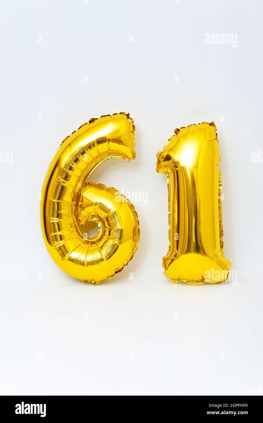 Inflatable numeral 61 sparkling metallic golden color isolated on white ...