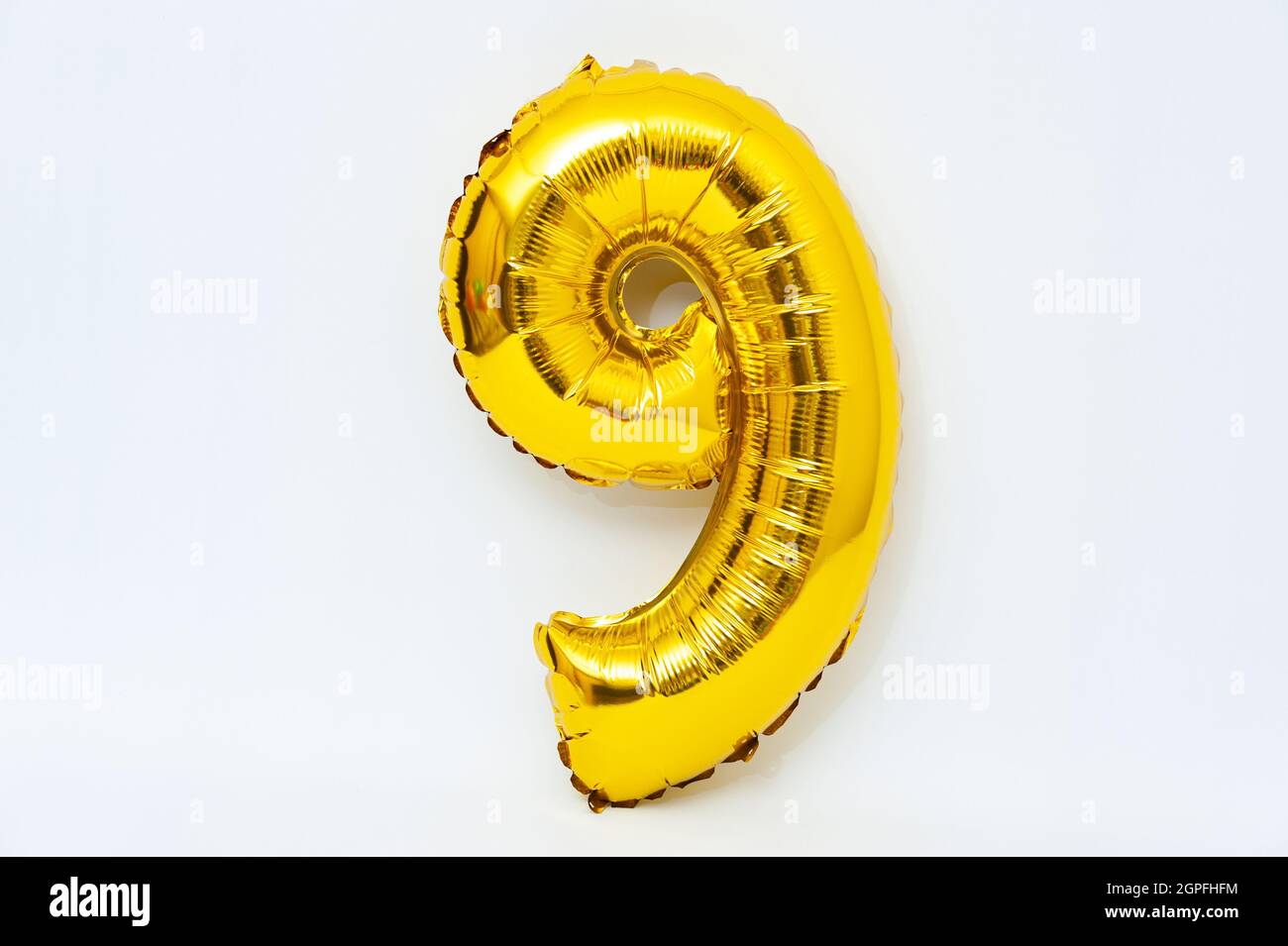 Inflatable numeral 9 sparkling metallic golden color isolated on white ...